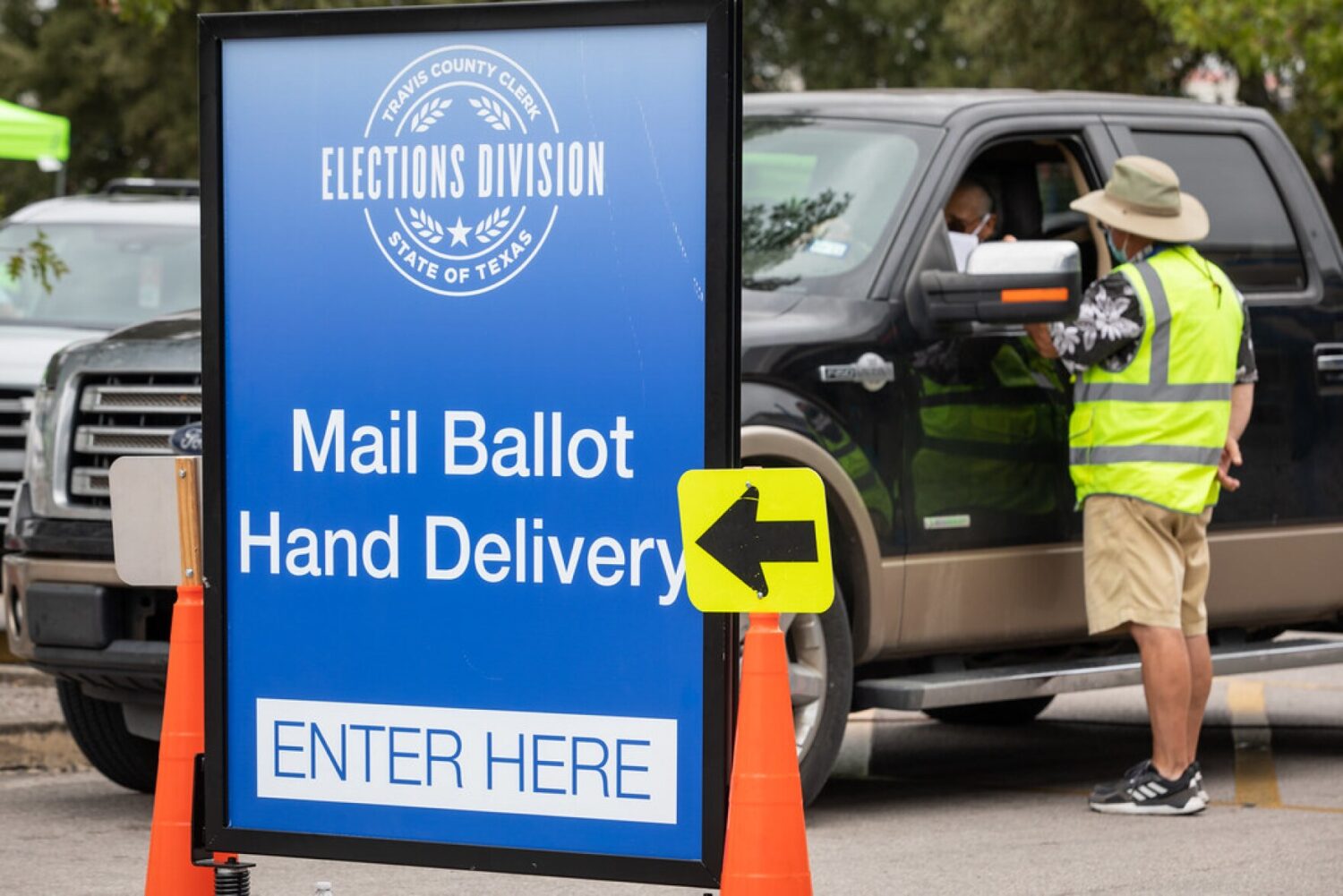 Judge temporarily halts part of Texas’ voting law that bans officials ...